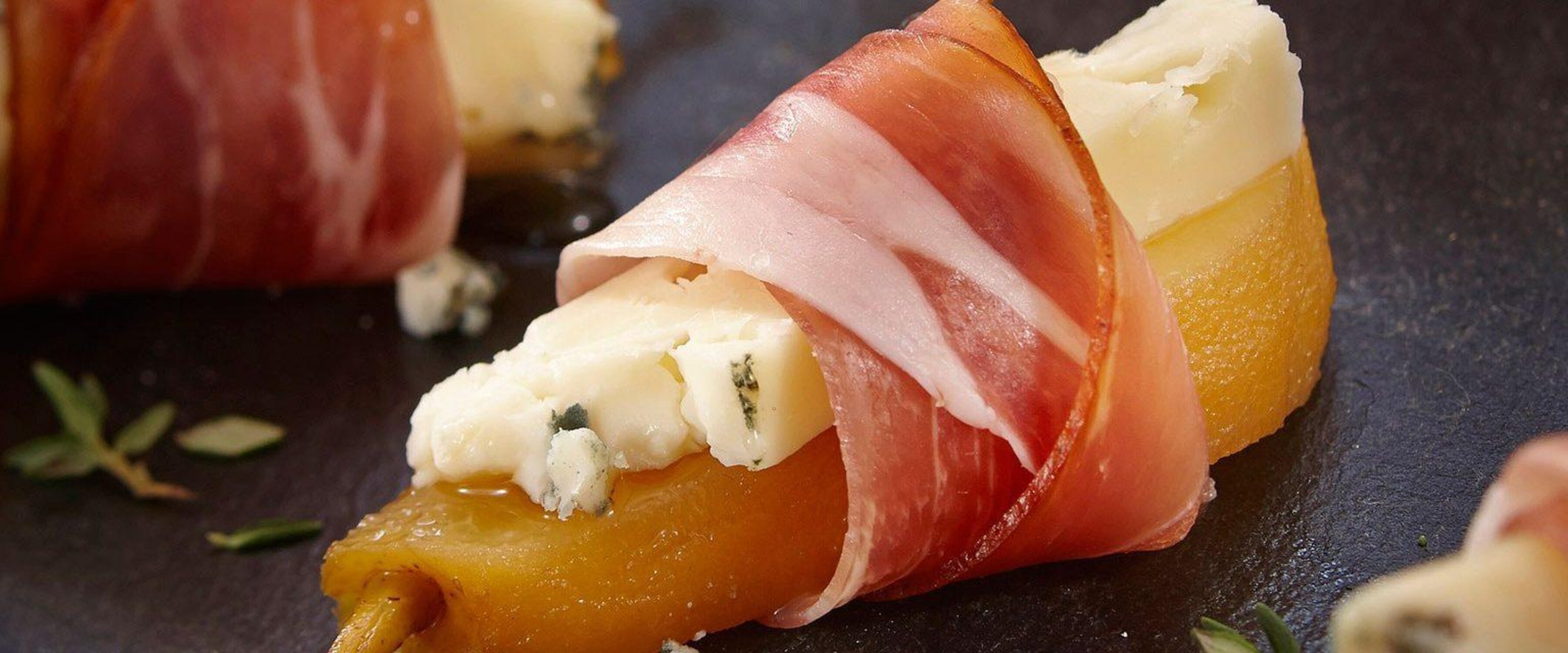 Smoked Prosciutto Wrapped Poached Pears with Gorgonzola - Black Kassel
